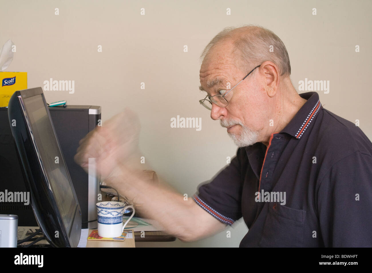 Man at computer showing emotions from puzzlement to rage Stock Photo ...