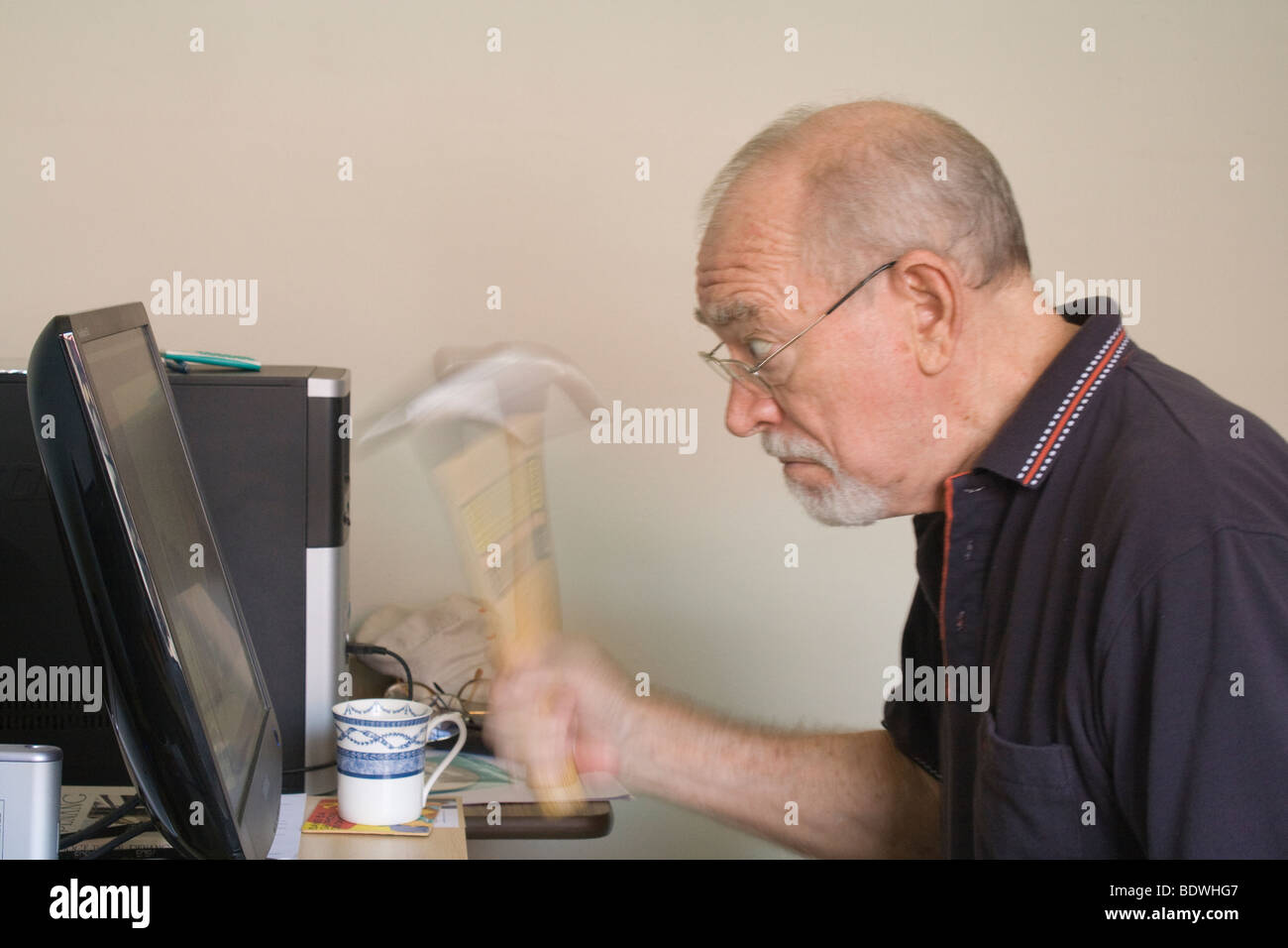 Man at computer showing emotions from puzzlement to rage Stock Photo ...