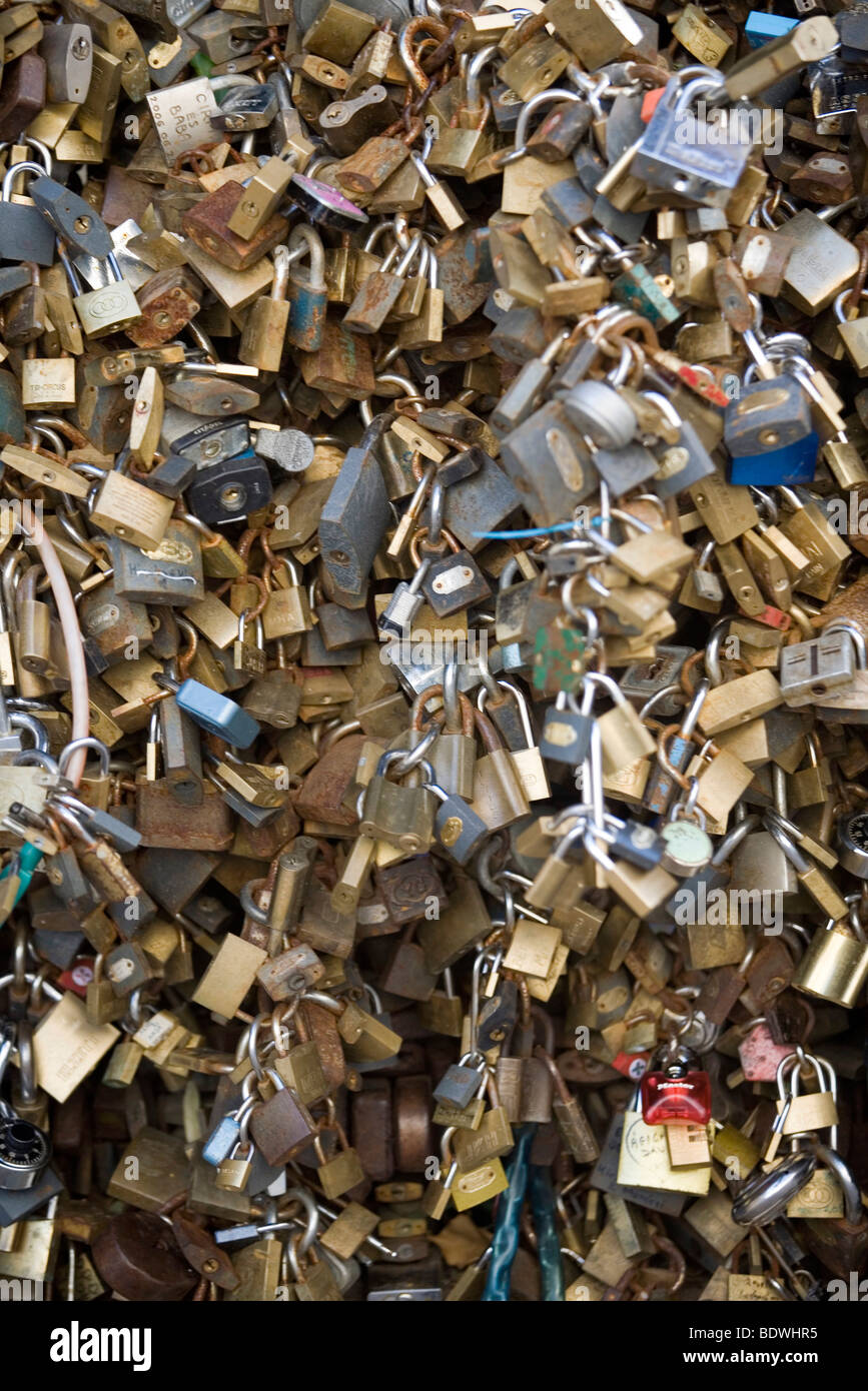 A wall and fence covered in padlocks in Pecs, Hungary Stock Photo - Alamy