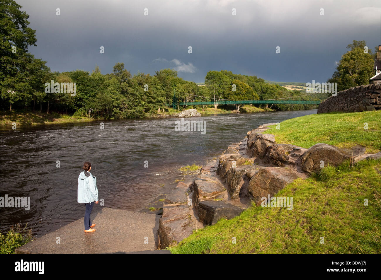 Riverside landscape with footbridge and the River Tay at Pitlochry, in ...