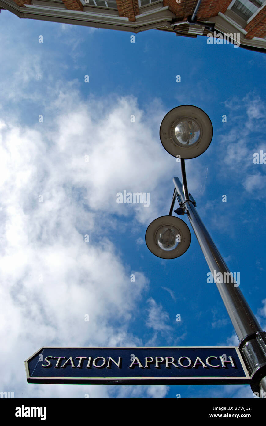 street sign and direction pointer for station approach, in kew ...