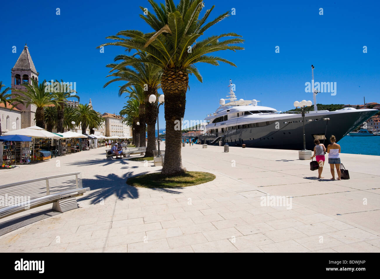 Waterfront promenade of Trogir, on the right bell-tower of the ...