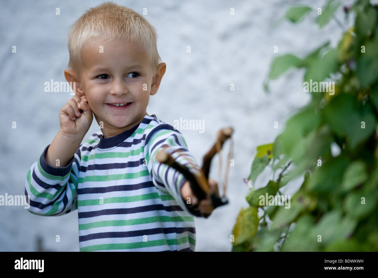 Boy with beanshooter Stock Photo - Alamy