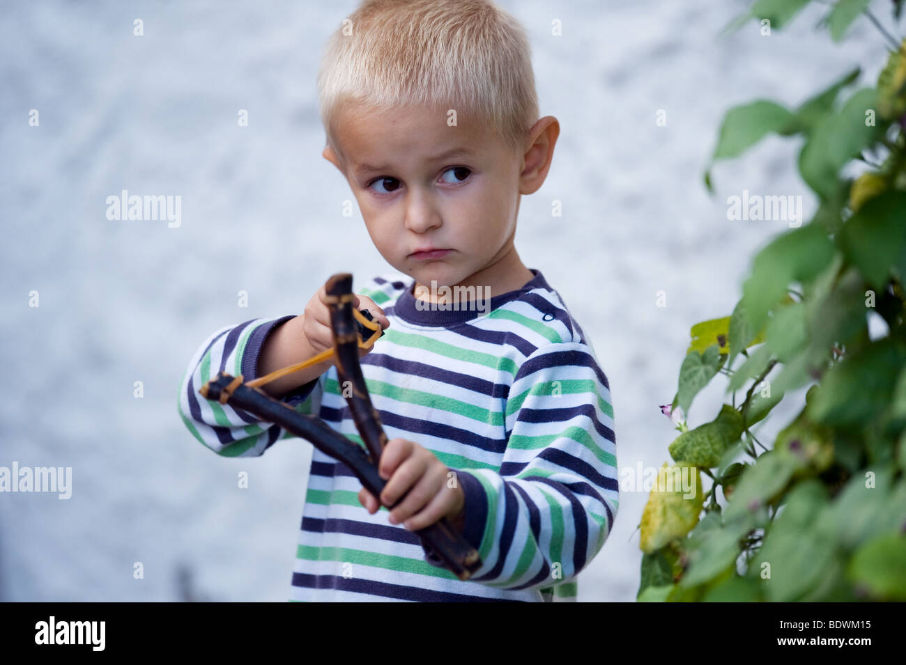 Boy with beans hooter Stock Photo - Alamy