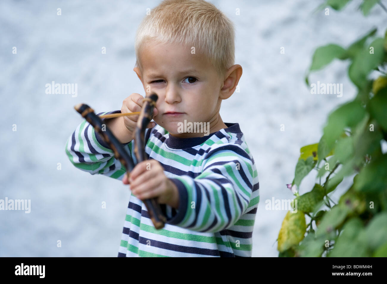 Boy with beanshooter Stock Photo - Alamy