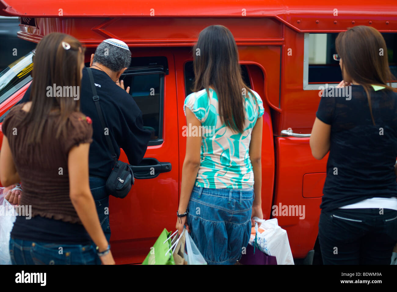 Tourists negotiate with songthaew taxi in Chiang Mai Thailand Stock ...
