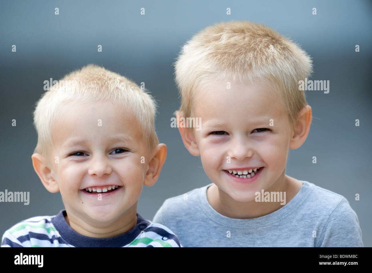 Two smiling brothers Stock Photo - Alamy