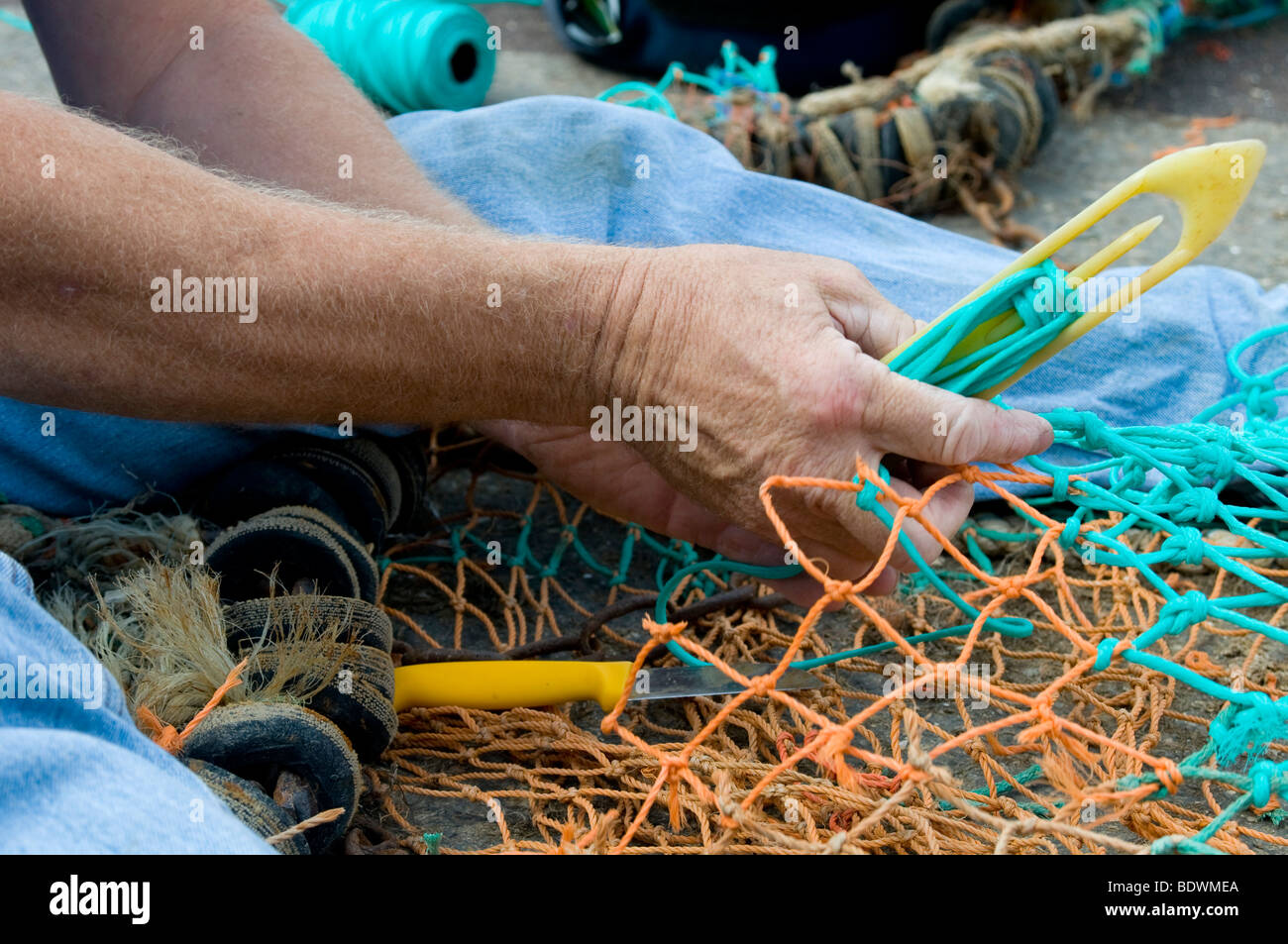 Fishermen repairing boat uk hi-res stock photography and images - Alamy