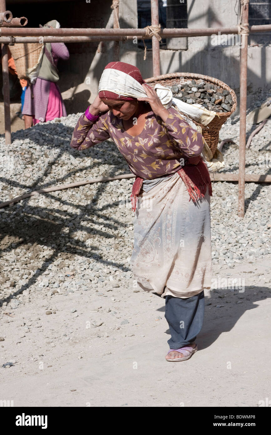 Kathmandu, Nepal. Nepali Woman Carrying Basket of Stones for Mixing ...