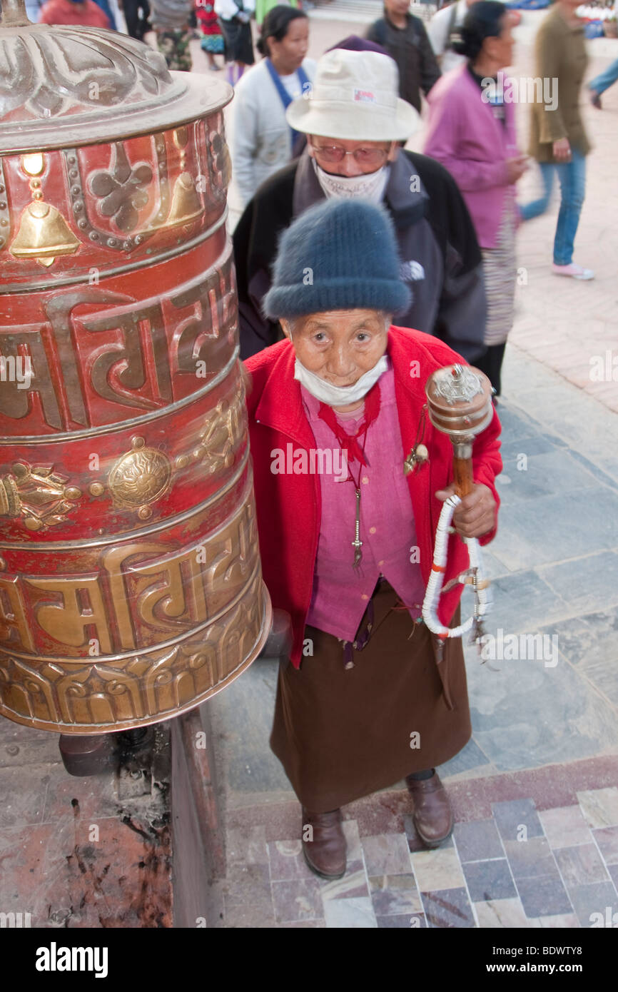 Bodhnath, Nepal. Nepalese Woman Circumambulating the Stupa Stops to ...