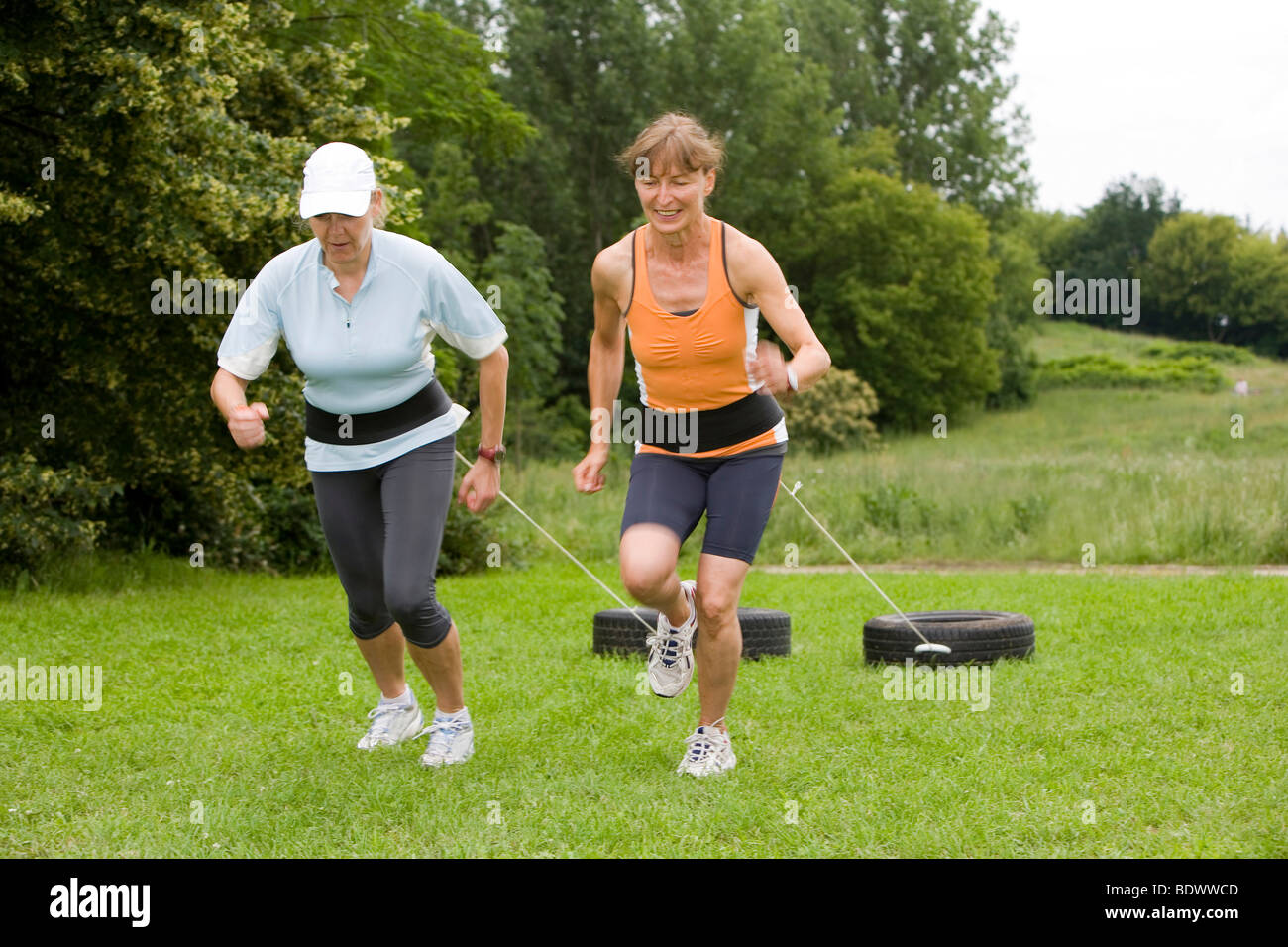 Two women pulling effort hi-res stock photography and images - Alamy
