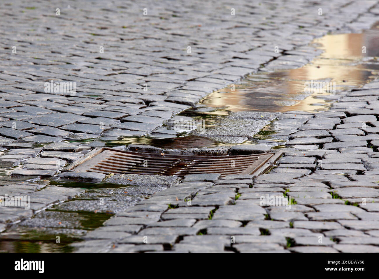 Manhole cover in road hi-res stock photography and images - Alamy