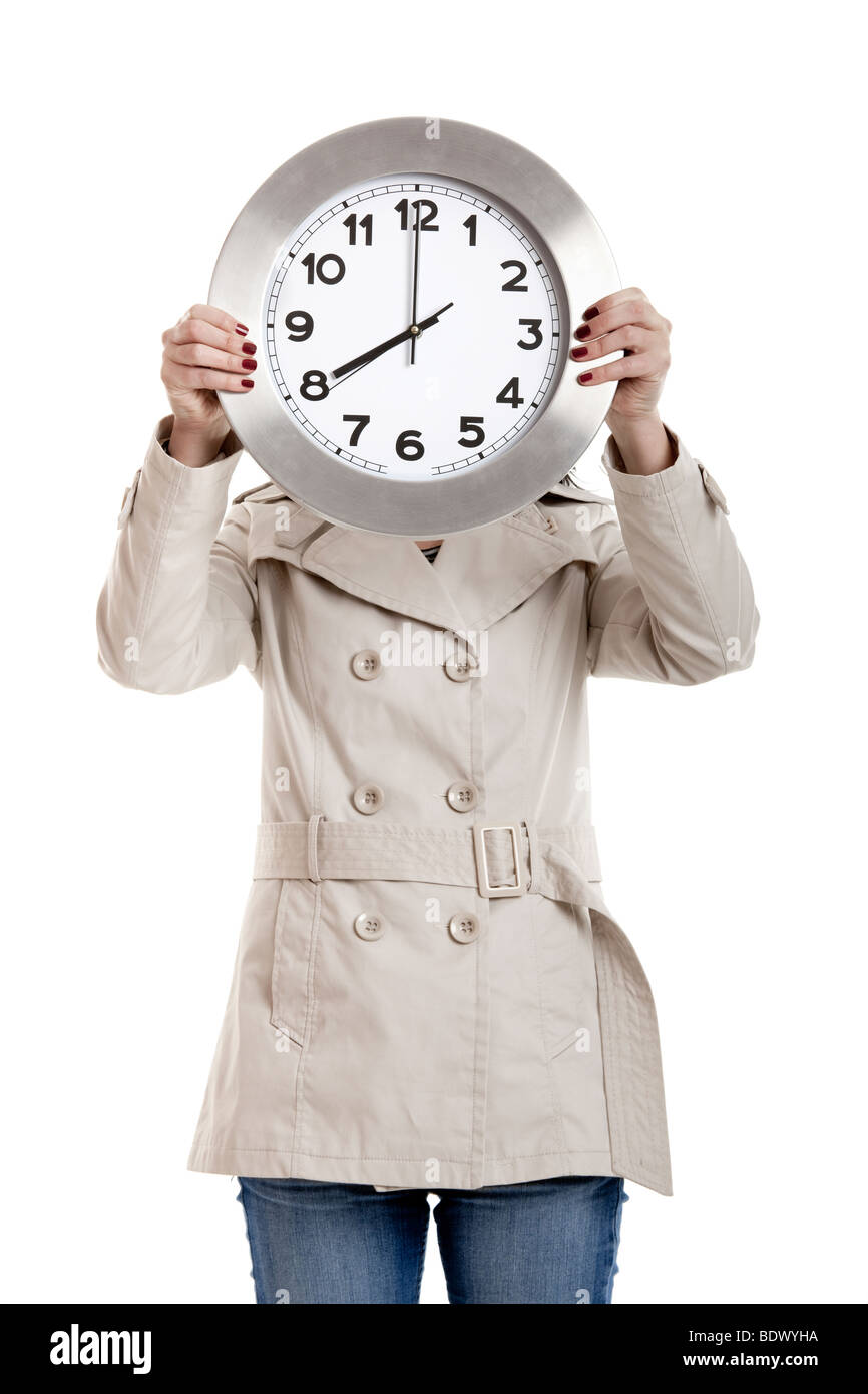 Woman hiding the face with a clock - isolated on white Stock Photo - Alamy