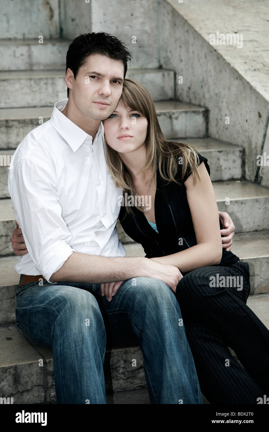 Young darkhaired woman sitting on stairs hi-res stock photography and images - Alamy