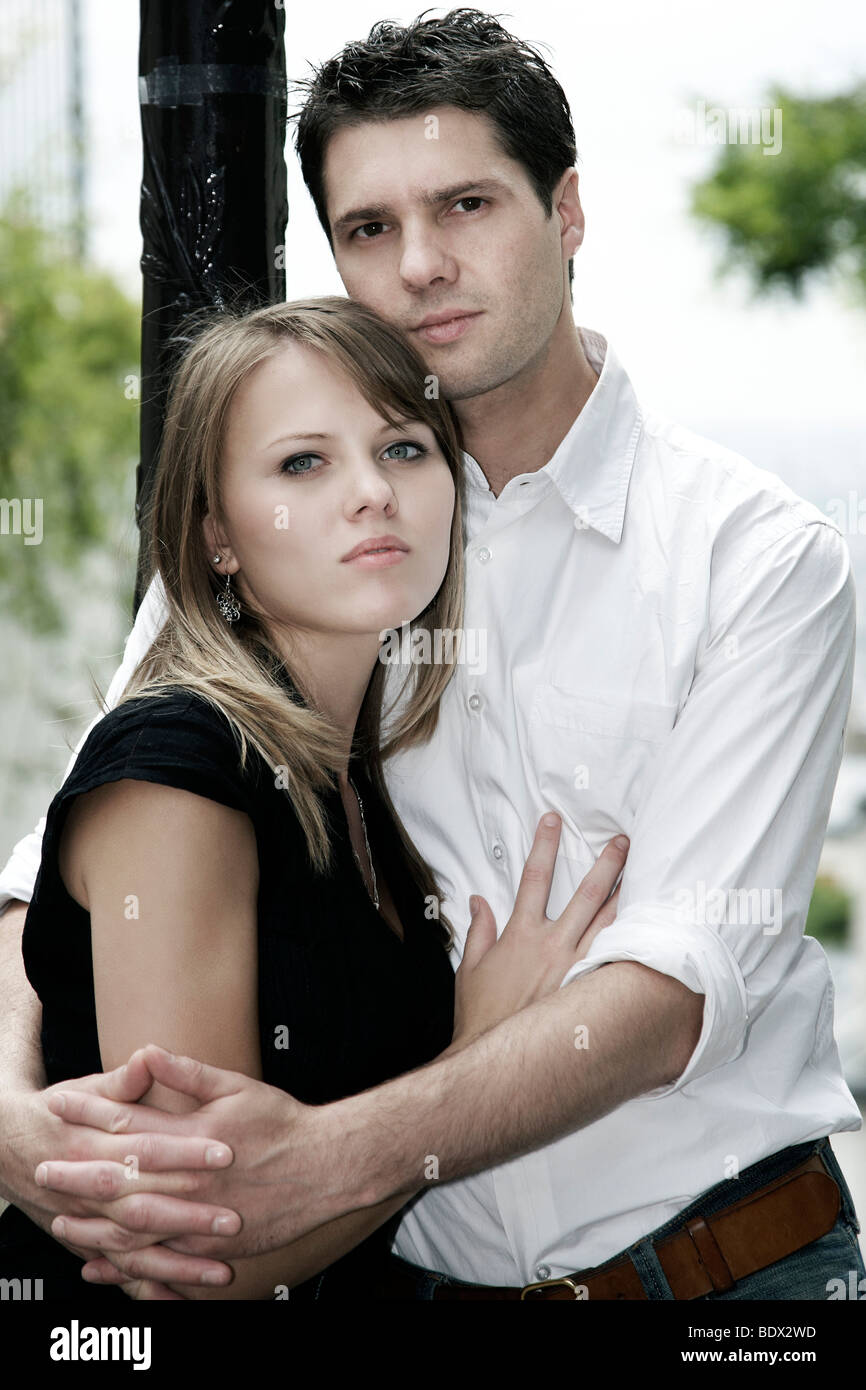 Young couple in love hugging, portrait Stock Photo - Alamy