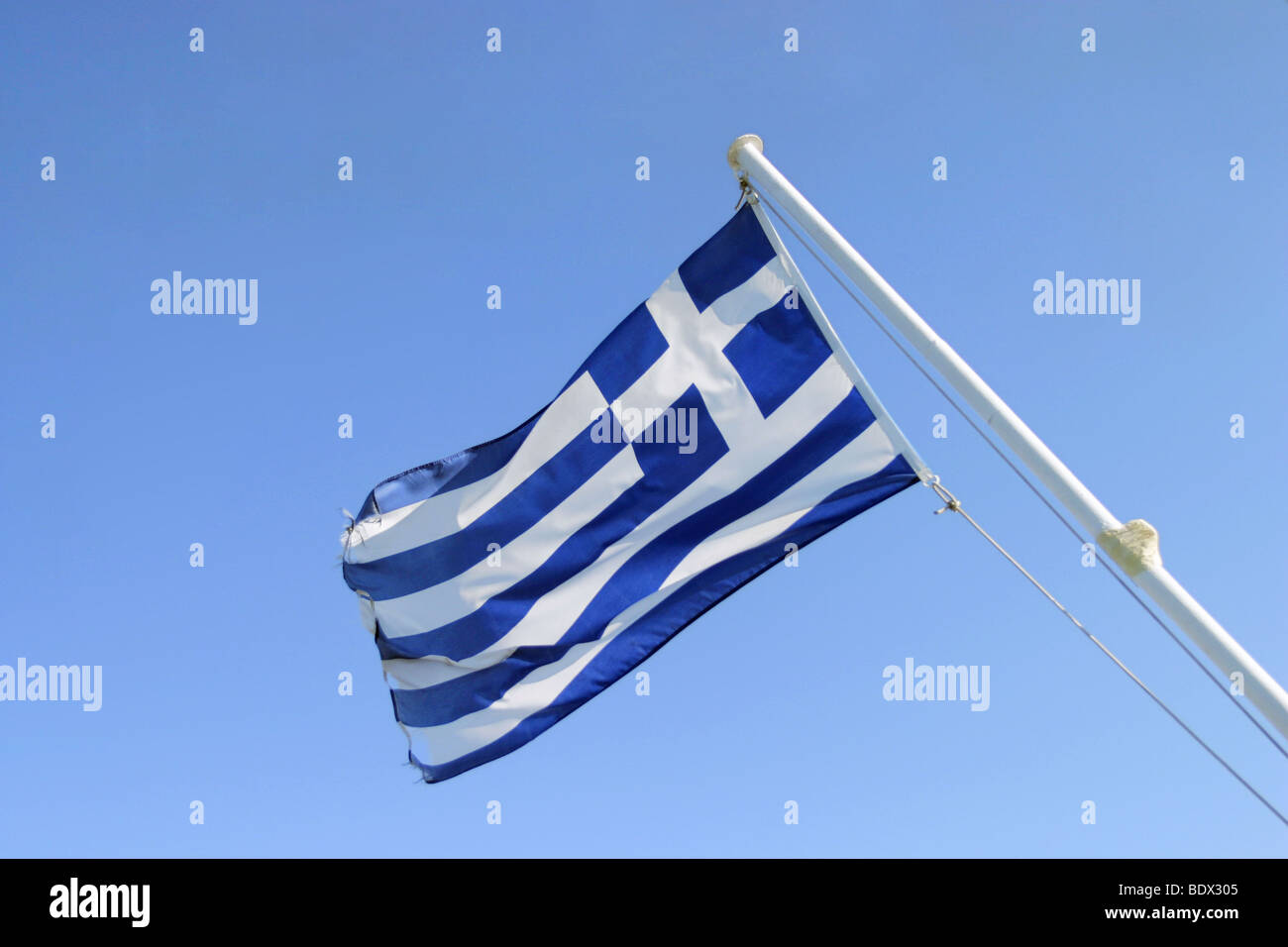 Greek flag flying against a blue sky Stock Photo - Alamy
