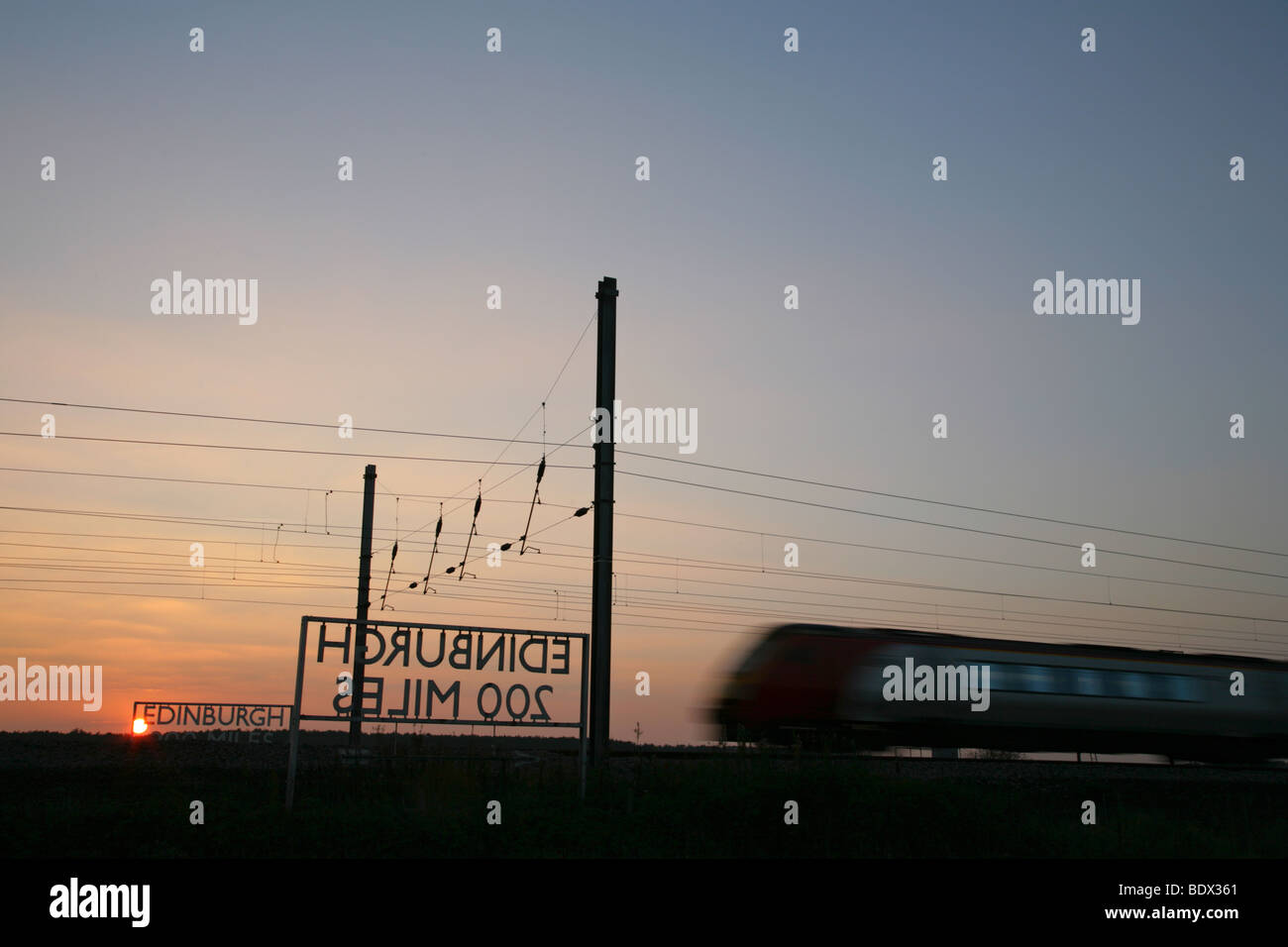 High speed train passing sign indicating 200 miles to Edinburgh, just ...
