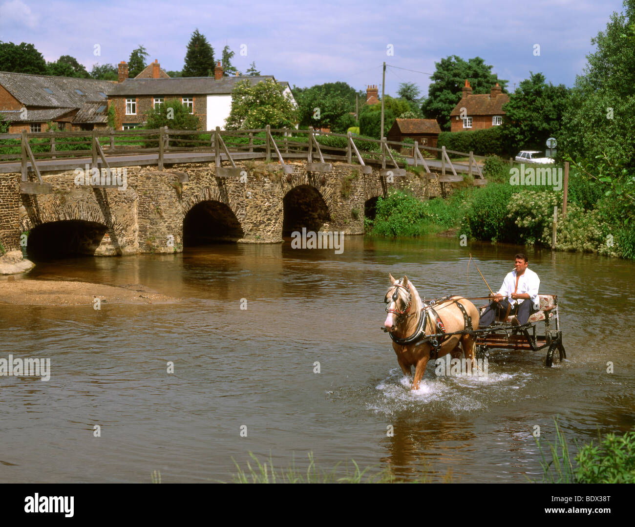 England Surrey Tilford Old bridge with horse & cart crossing river ...