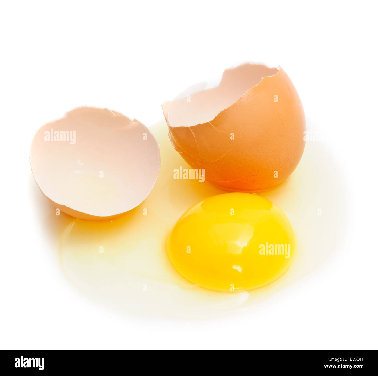 Broken egg isolated on a white background Stock Photo - Alamy