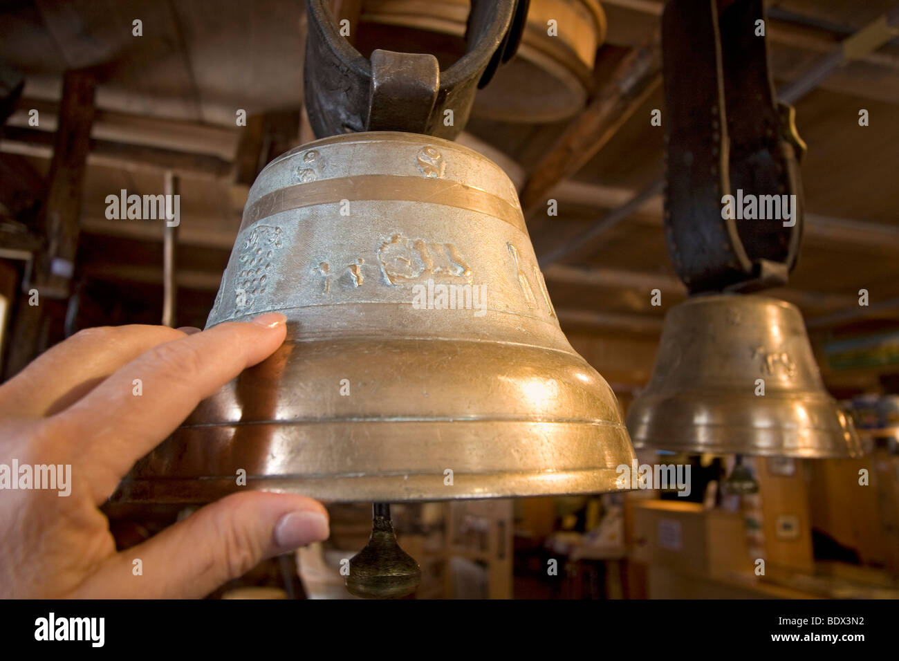 Very large cowbell hanging in town museum in Grindelwald, Switzerland ...
