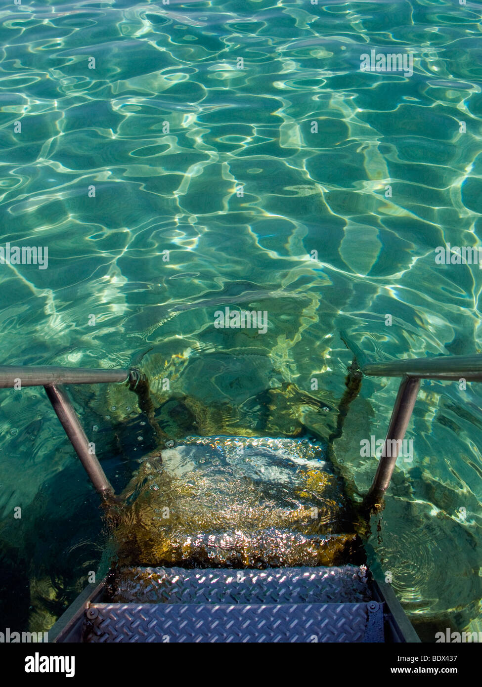 Stairs leading down into the Mediterranean sea at Fig Tree Bay ...