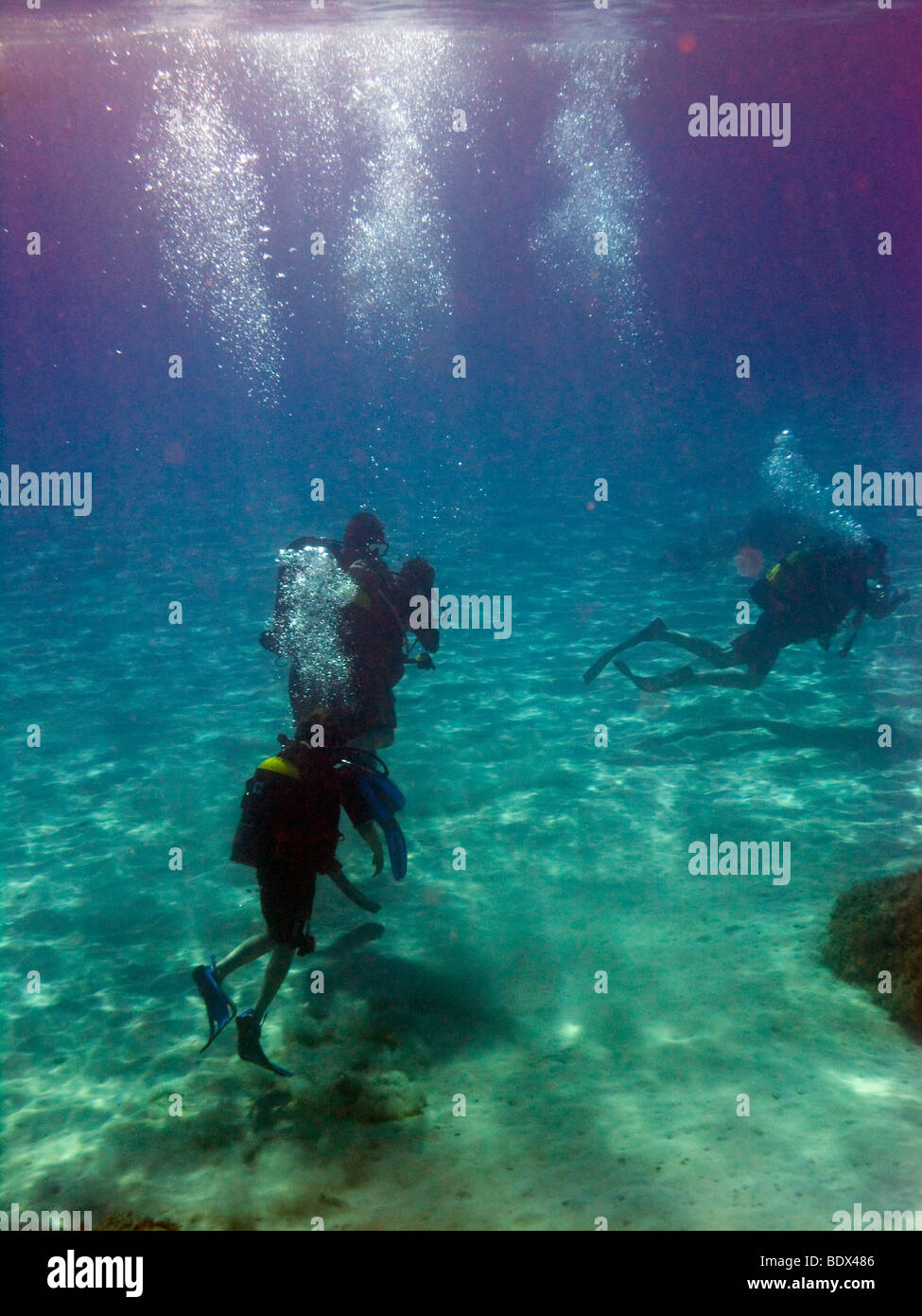 Scuba diving tourists at the Blue Lagoon, Cape Greco, Cyprus. This is a ...