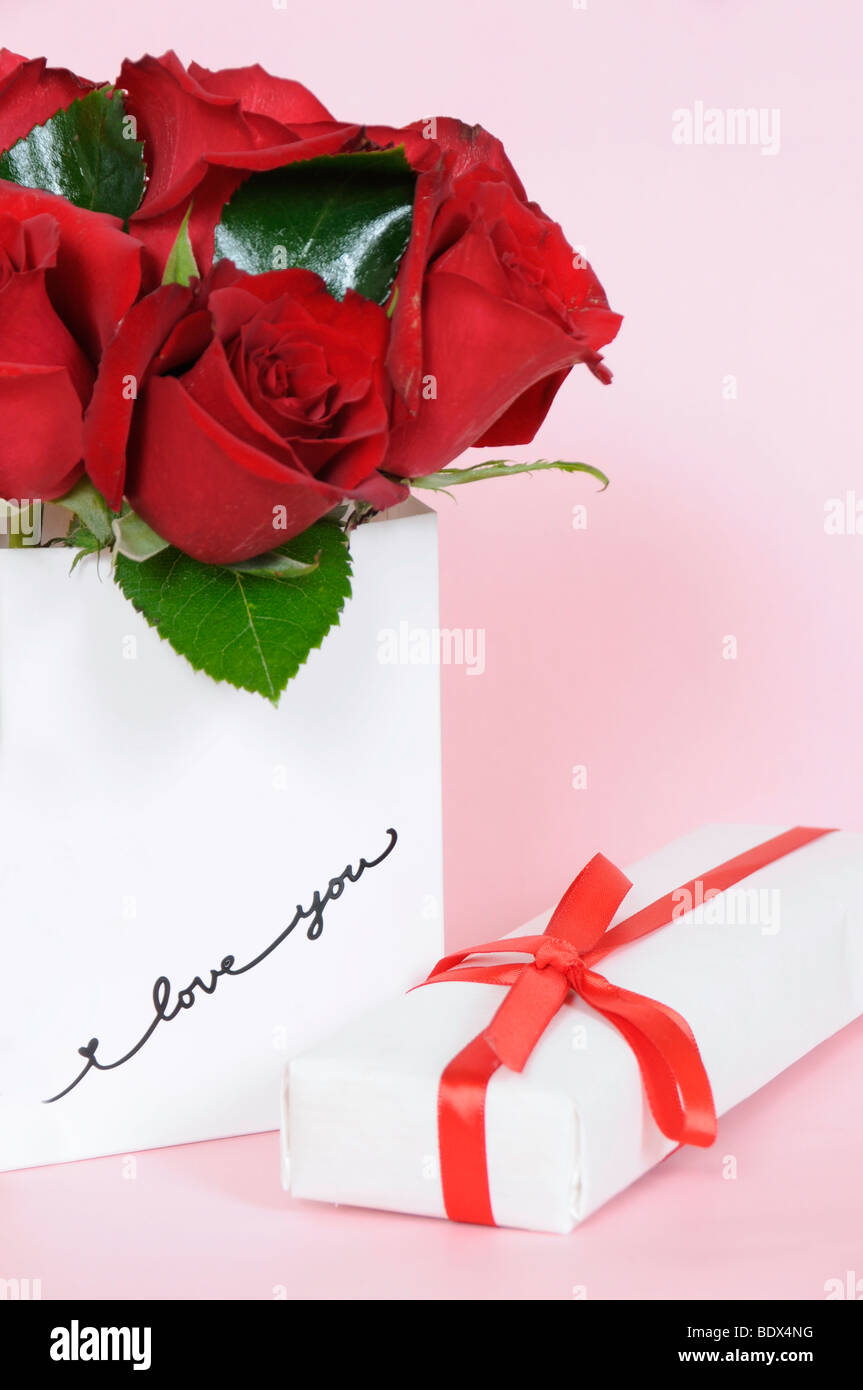 Bouquet of Red Roses with Gift Stock Photo - Alamy