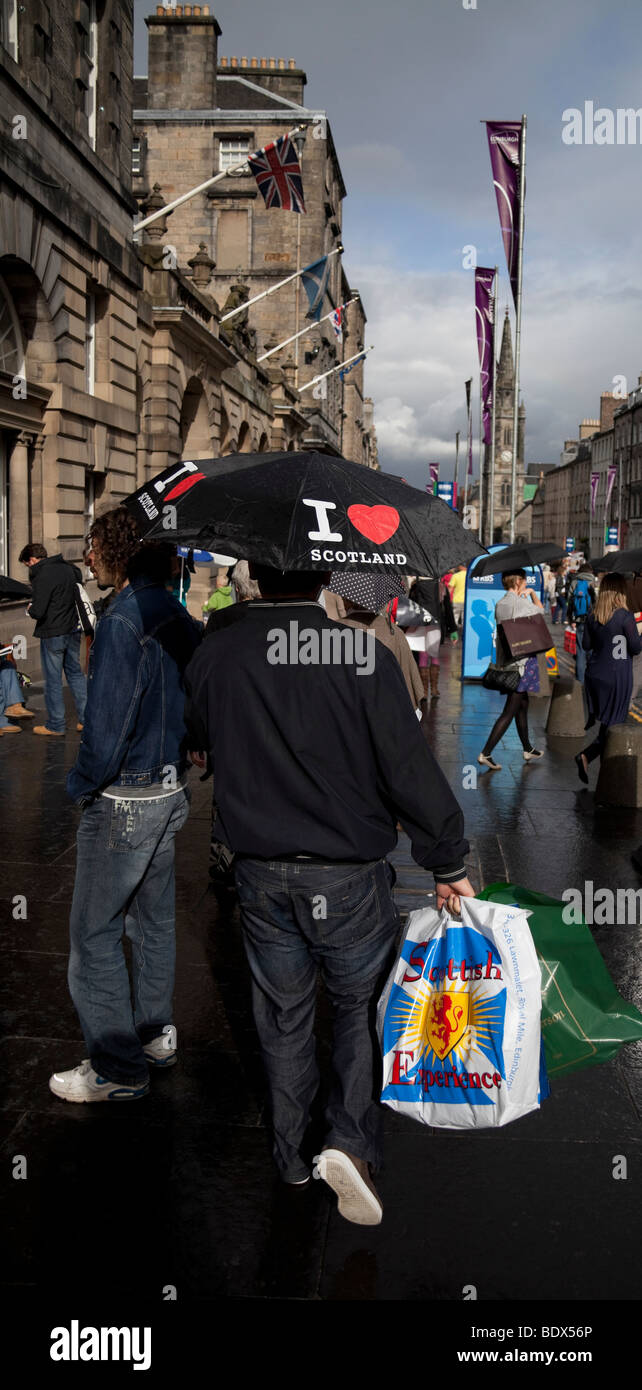 Man with umbrella printed with 'I love Scotland', Edinburgh, UK, Europe ...