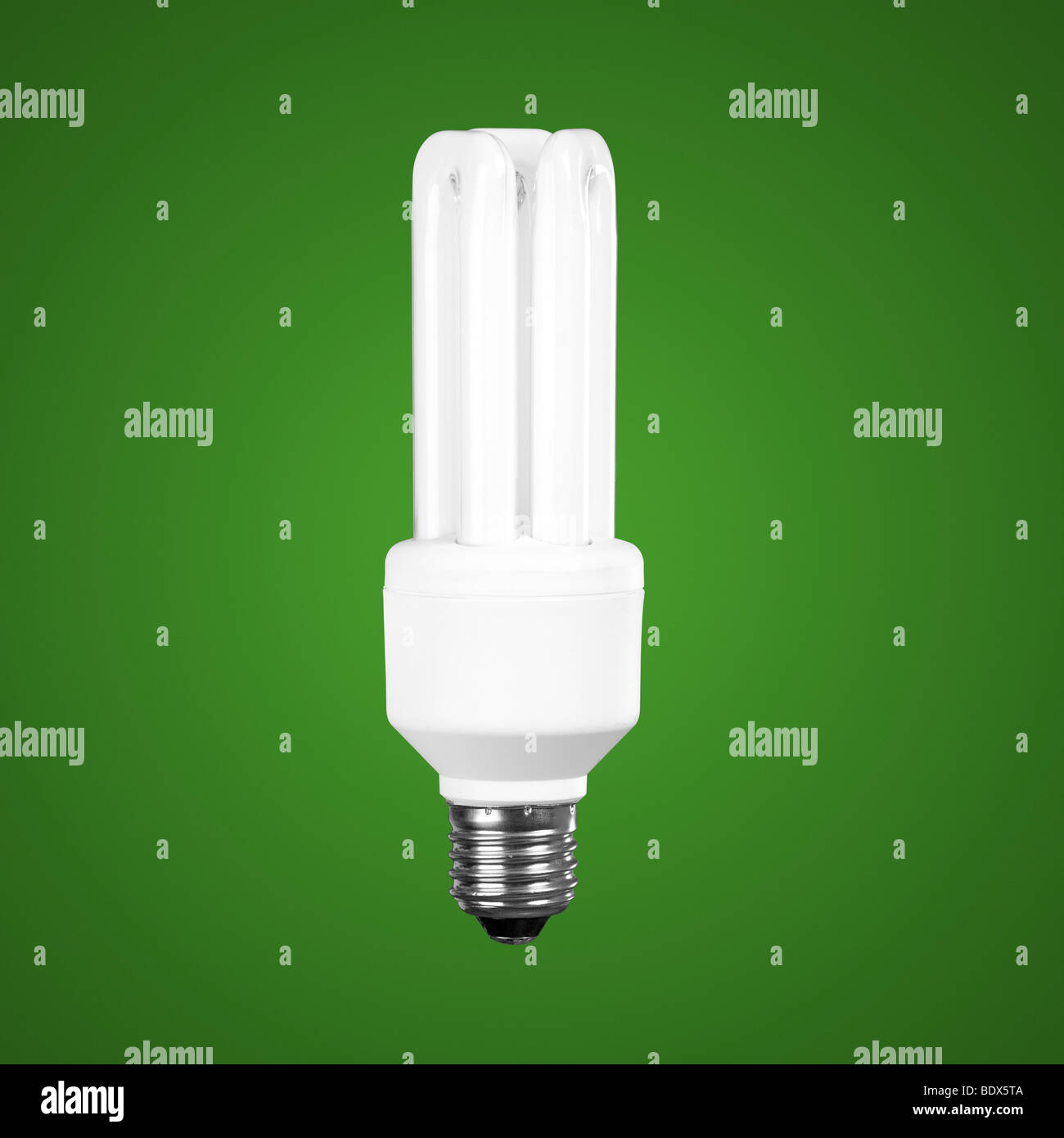 Fluorescent Light Bulb on a green background – energy concept Stock ...