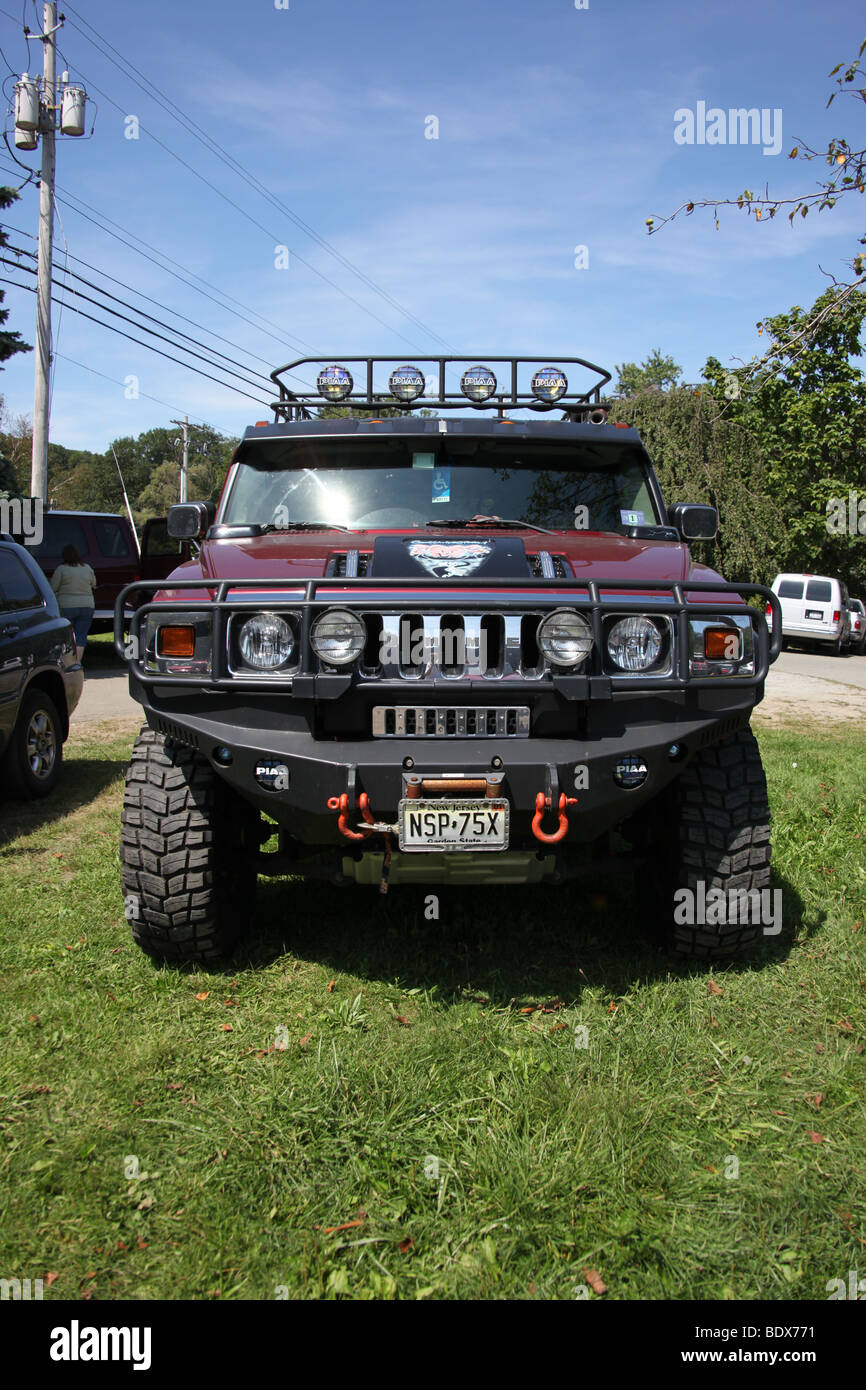 Hummer sport utility vehicle parked in a grassy lot in Orange County ...