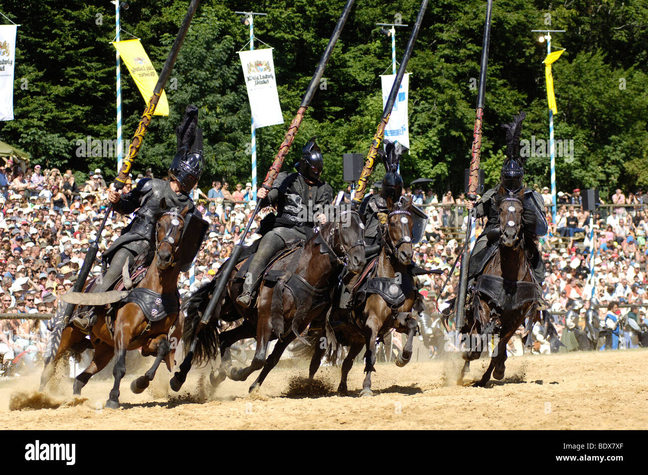 Four black knights riding horses, Knights' Tournament in Kaltenberg ...