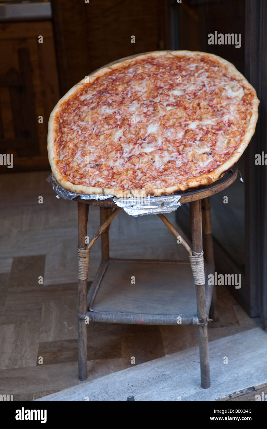 Exhibition of a giant traditional Italian pizza with cheese, pepperoni ...