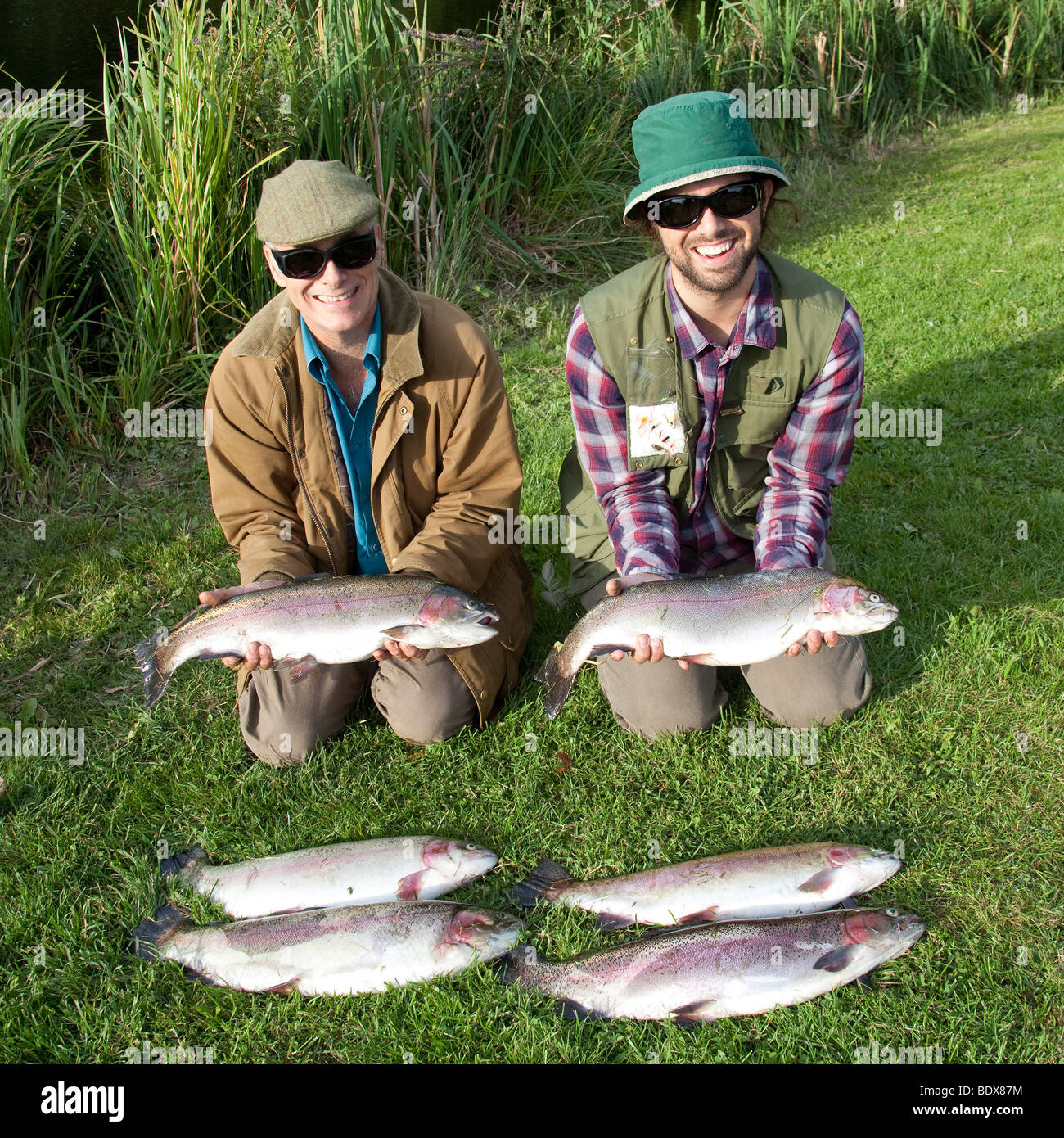 Fly fishermen with six large rainbow trout, Avington Fishery, Hampshire ...