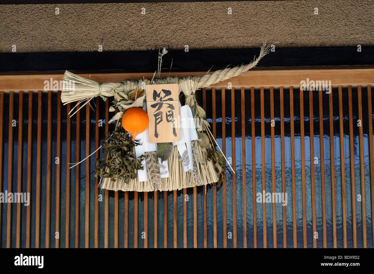 Shimenawa, straw rope hung over the entrance door at the New Year's ...