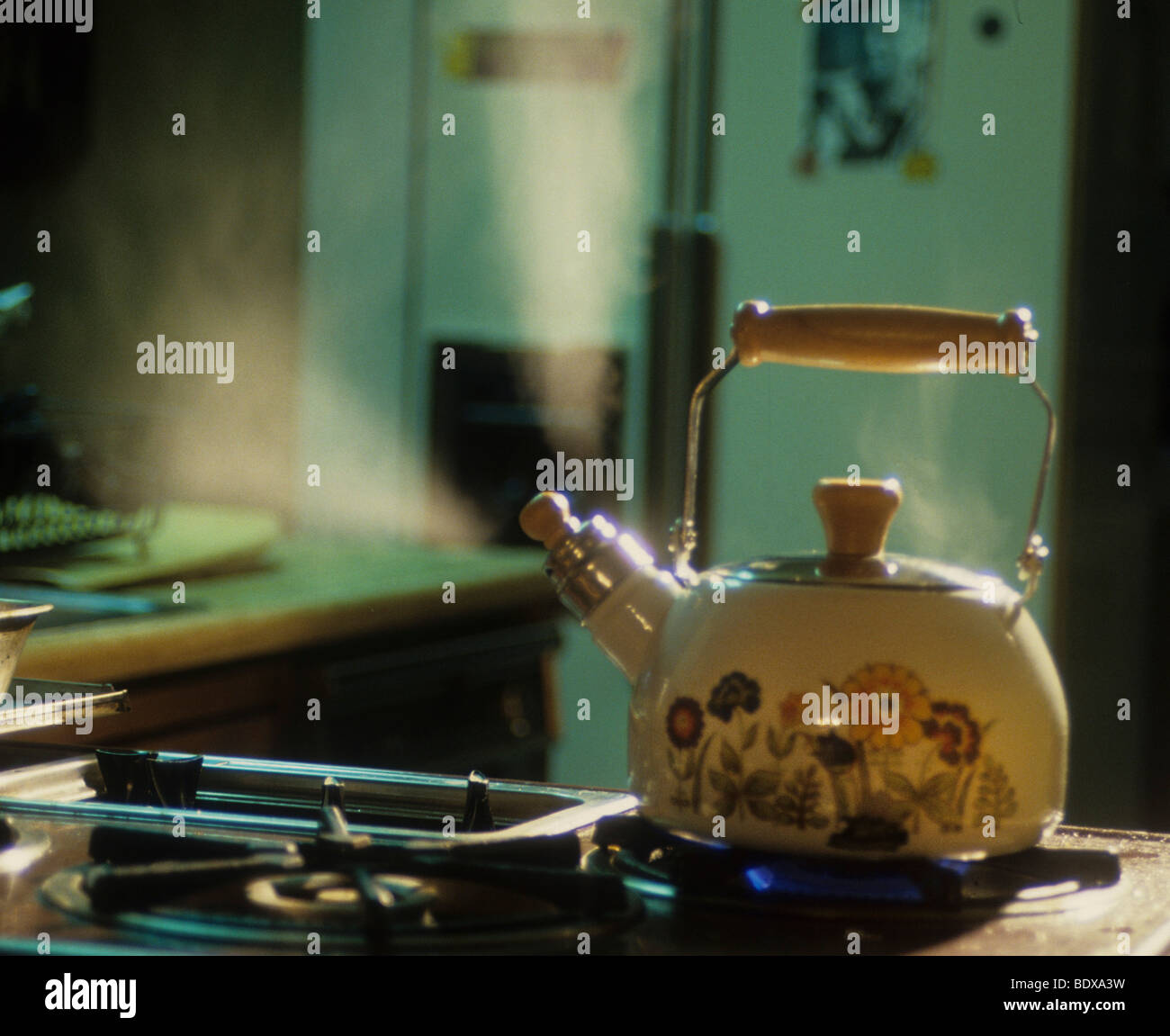 blue flame under teapot causes water inside to expand into steam which ...