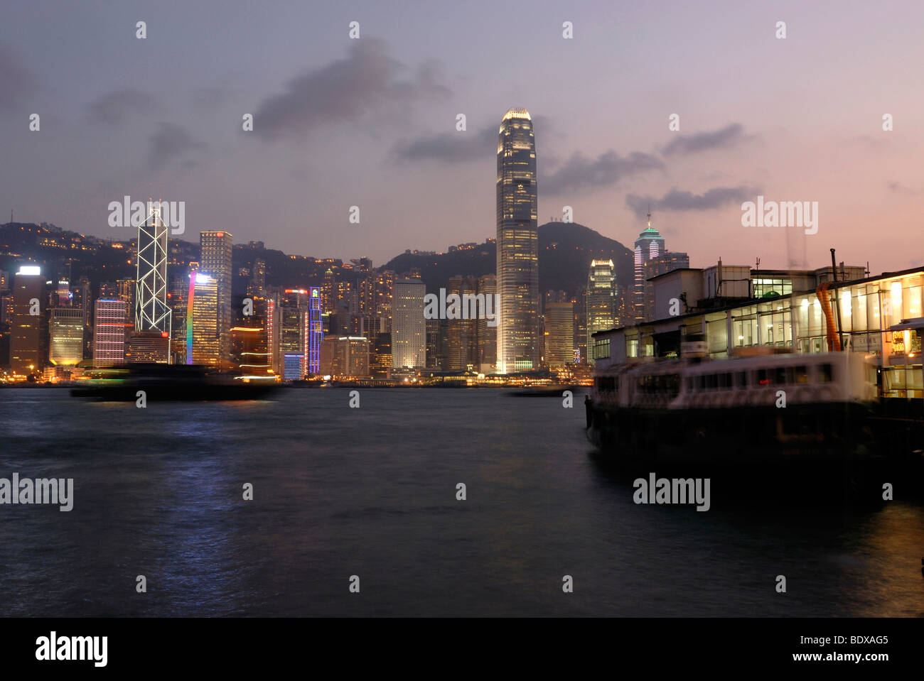 Star Ferry at the illuminated Star Ferry Kowloon pier, overlooking the ...
