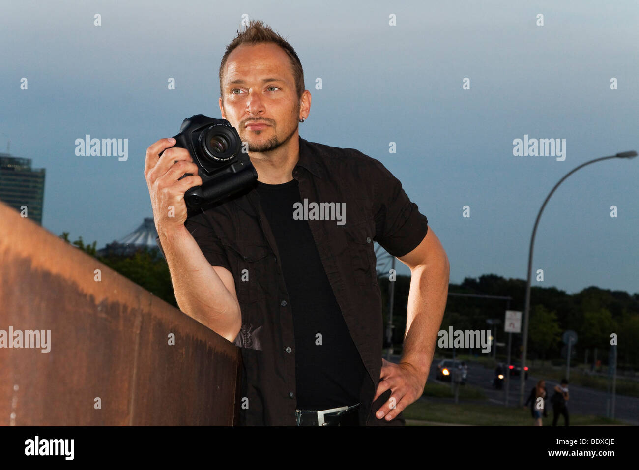 Photographer waiting for the right lighting and motif Stock Photo - Alamy