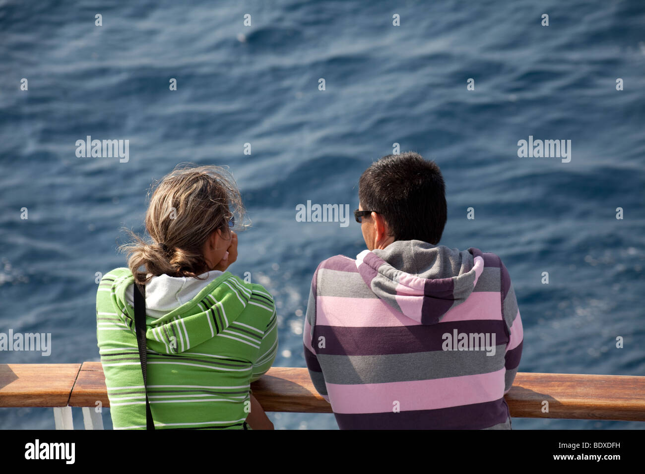 people talking on a ferry looking at the sea Stock Photo - Alamy