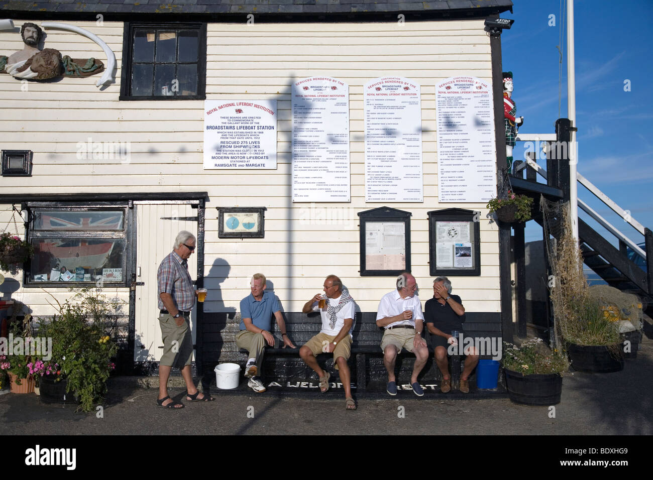 Men having a pint of beer in Broadstairs, Kent Stock Photo - Alamy