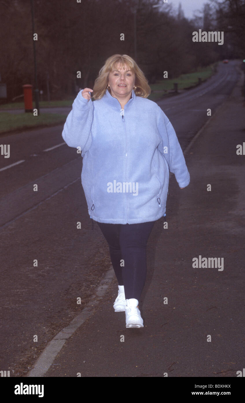 overweight woman power walking Stock Photo - Alamy