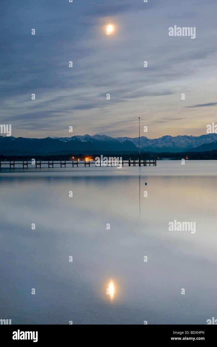 Full moon and its reflection in Lake Starnberg with the Bavarian Alps ...