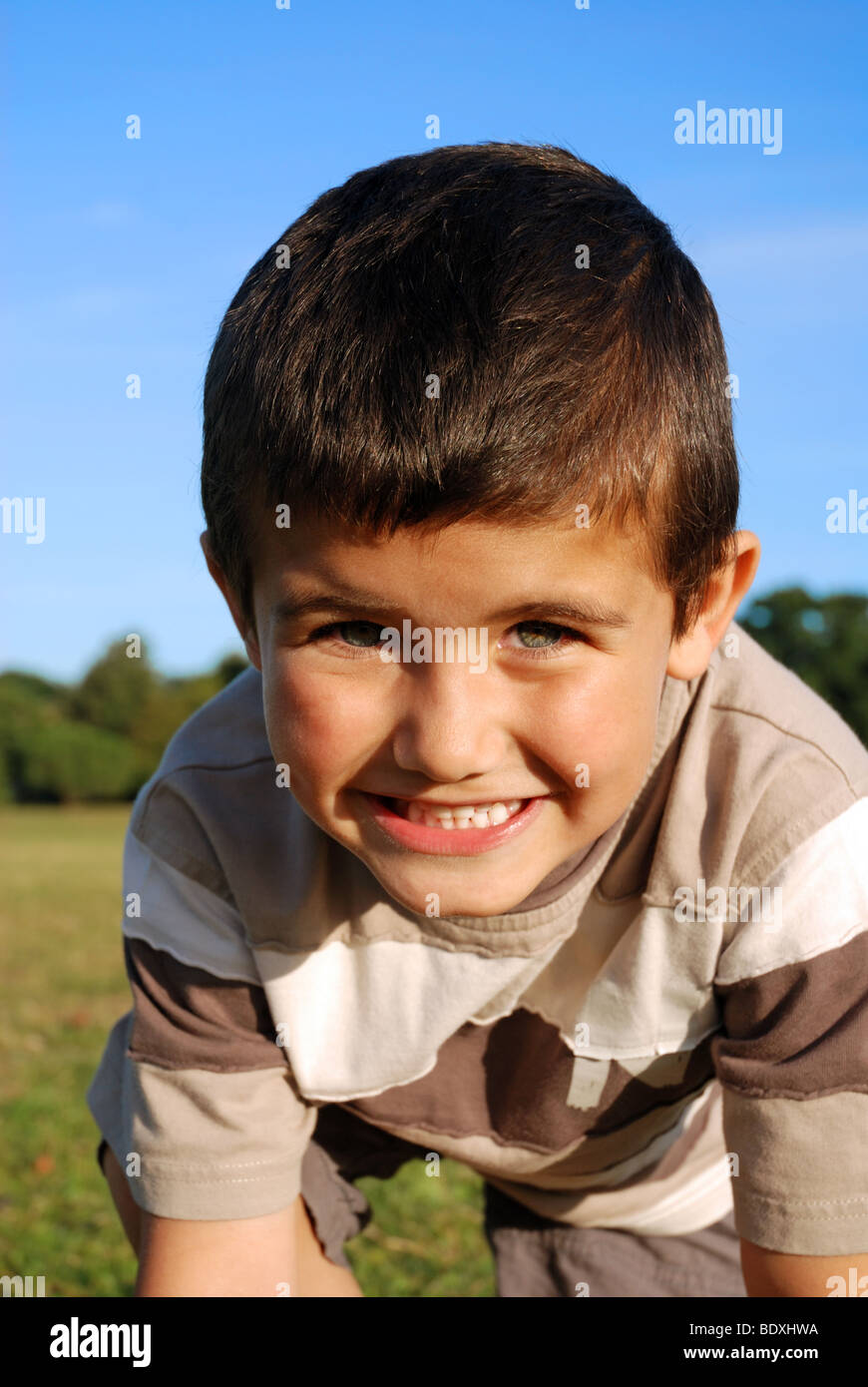 Young child smiling into the camera Stock Photo - Alamy