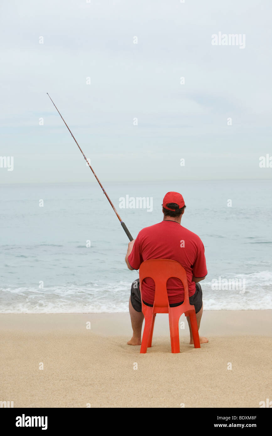 Man Sitting In Chair Fishing High Resolution Stock Photography and ...