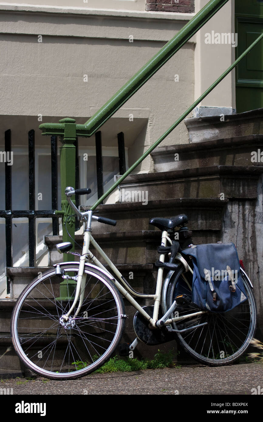 Bike against railing in Amsterdam Stock Photo - Alamy