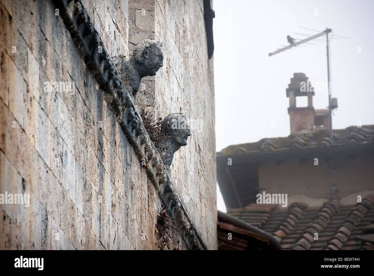 Carved stone corbels in the shapes of heads in the Village of Torri Val ...