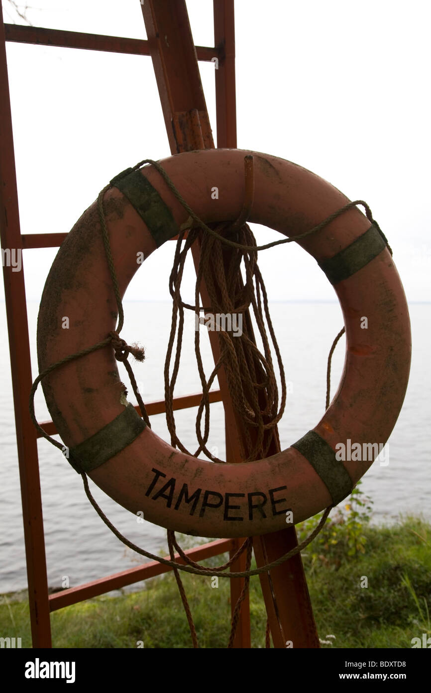 A lifebelt (lifebuoy) is attached to a ladder by Nasijarvi Lake, to the ...