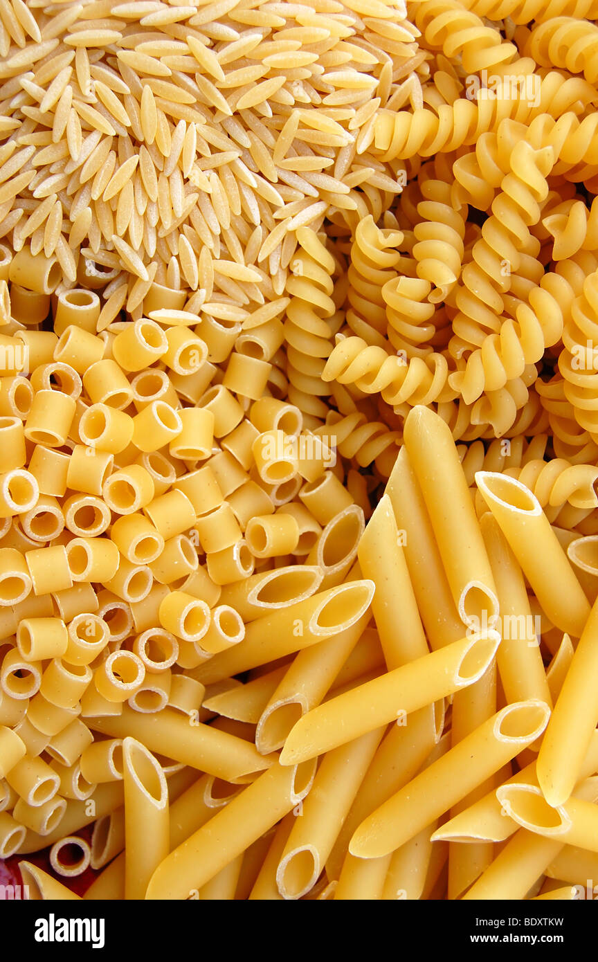 Four different kinds of italian pasta. Food background Stock Photo - Alamy