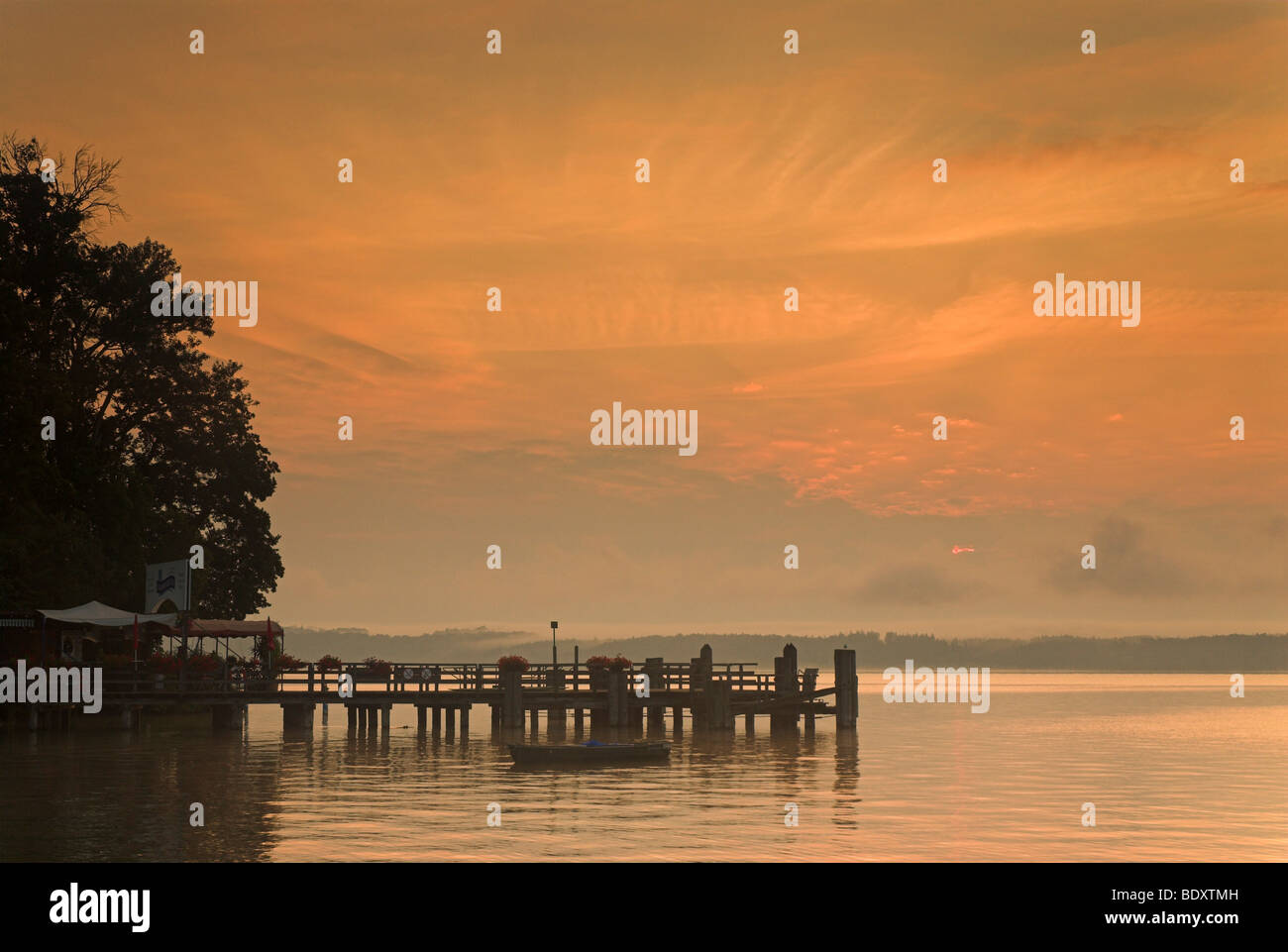 Sun rising over the pier of Tutzing at Lake Starnberg, Bavaria, Germany ...