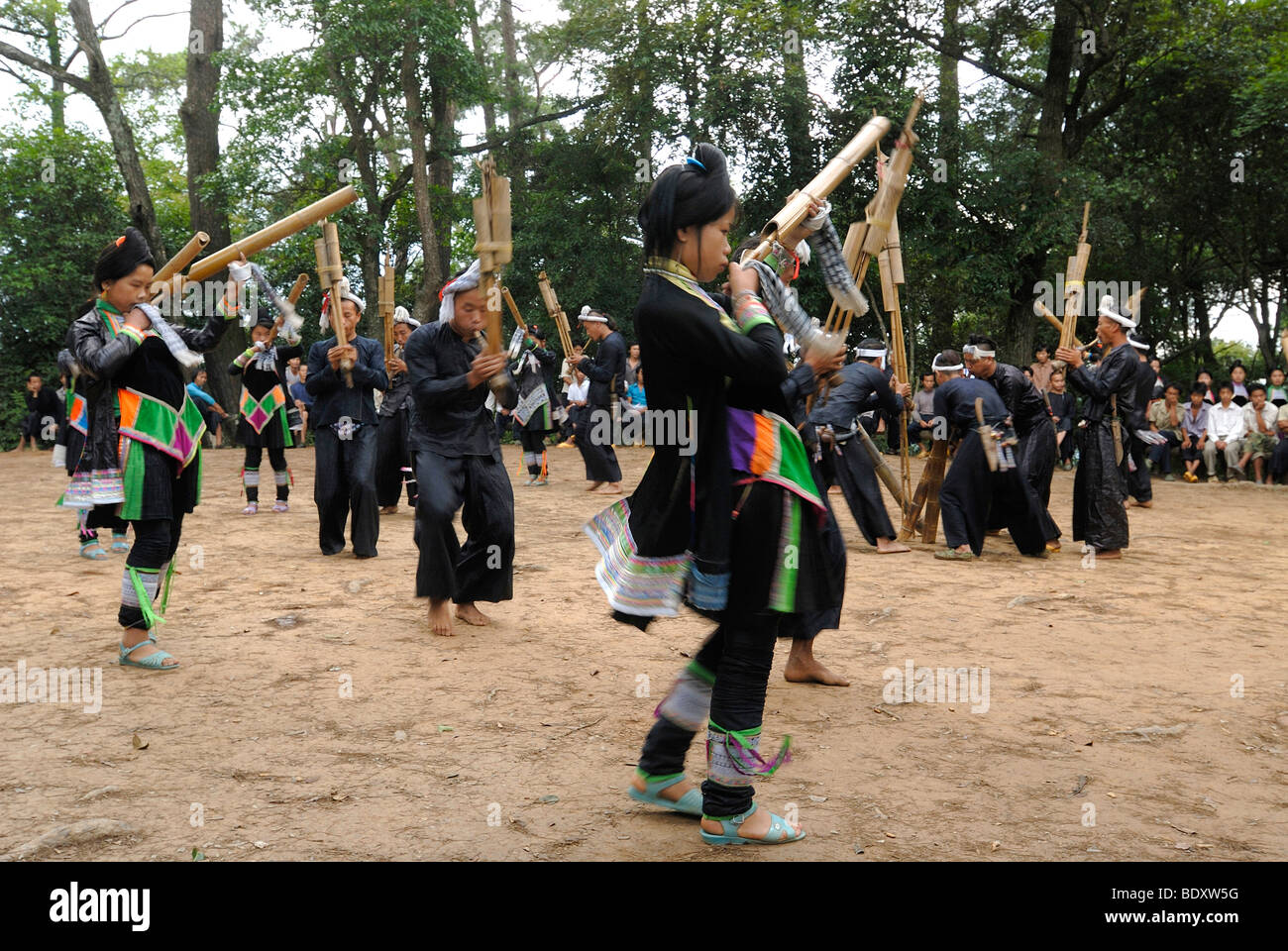 Men and women of a Lusheng orchestra in traditional costumes of the ...