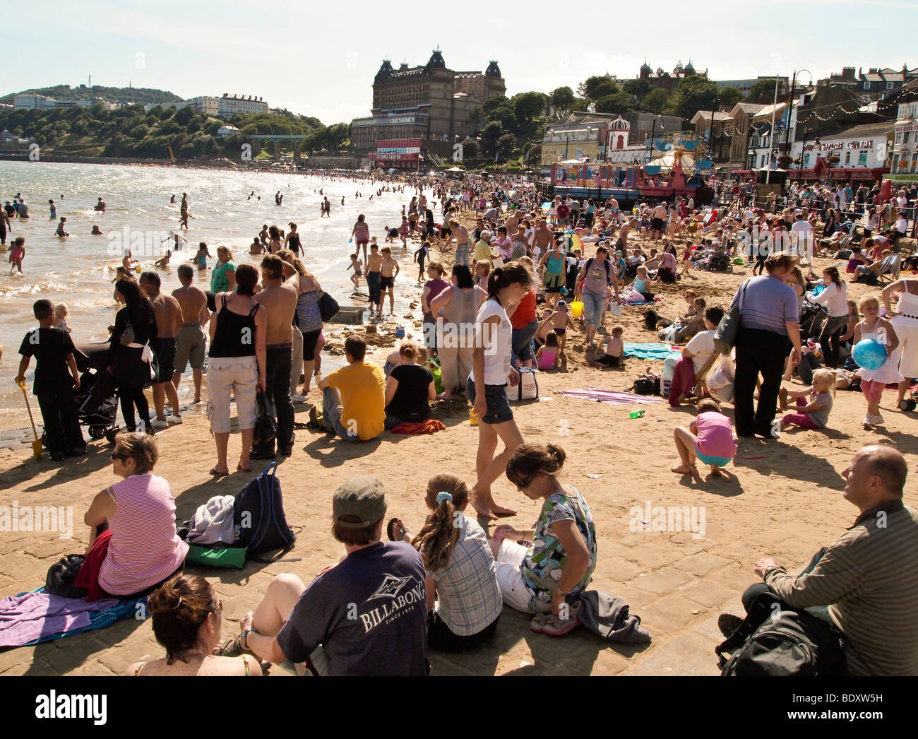 Crowded south beach and Grand Hotel Scarborough Yorkshire UK Stock ...